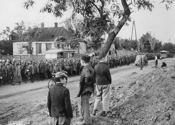 Figure 1.-- Here we see some Soviet boys watching a long line of Red ...